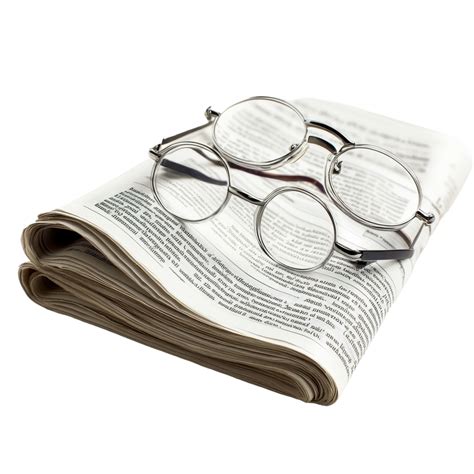 Reading Glasses Resting On Folded Newspaper With Clear Print And Simple