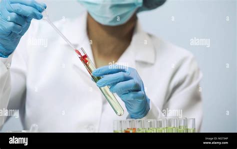 Female Intern Mixing Blood With Reagent In Tube Biochemical Experiment Stock Photo Alamy