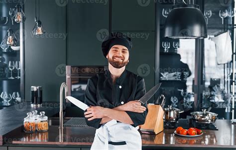 Portrait Of Professional Young Chef Cook In Uniform That Posing For