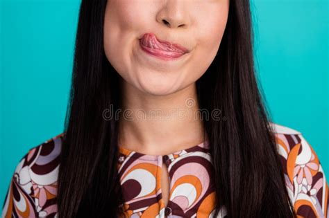 Close Up Cropped Portrait Of Nice Young Girl Tongue Lick Lips Isolated On Turquoise Color