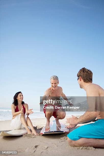 Three Mature Women On Beach With Surfboards Photos And Premium High Res Pictures Getty Images