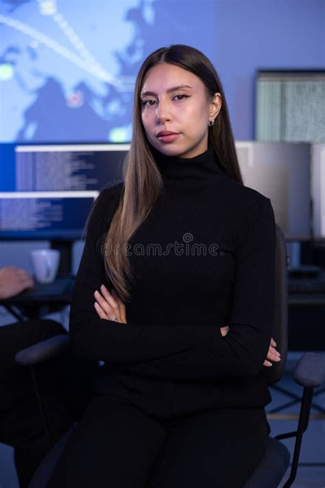 Portrait Of A Confident Female Cybersecurity Analyst Or Manager In Large Cyber Security