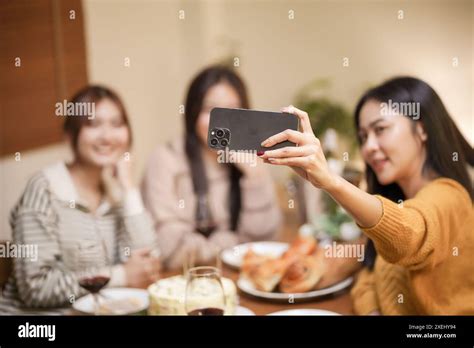 Asian Sister Friends Making Selfie And Smiling With Smartphone
