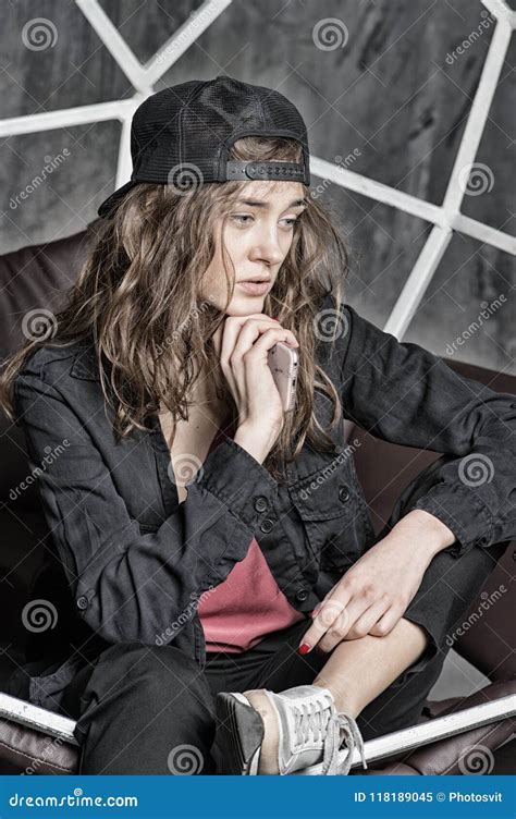 Beauty Girl With Hipster Look And Style Sensual Woman In Cap On Long