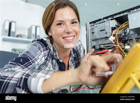 Happy Female Technician Fixing A Pc Stock Photo Alamy