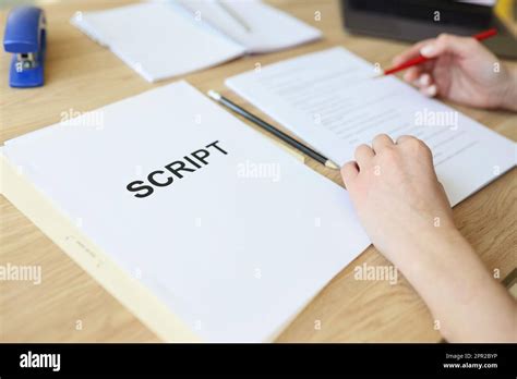 Attentive Woman Reads Script Papers Editing Text With Pencil Stock