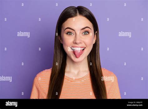 Closeup Photo Of Pretty Lady Sticking Tongue Out Mouth Teasing Friends