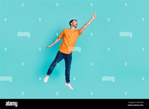 Full Body Photo Of Positive Person Raise Arm Hold Empty Space Banner