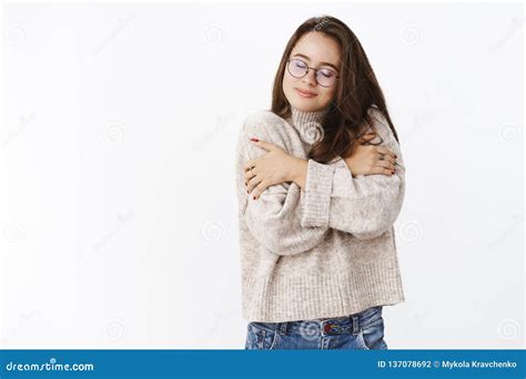 Girl Feeling Great In Soft Cozy Sweater During Chilly Weather Hugging