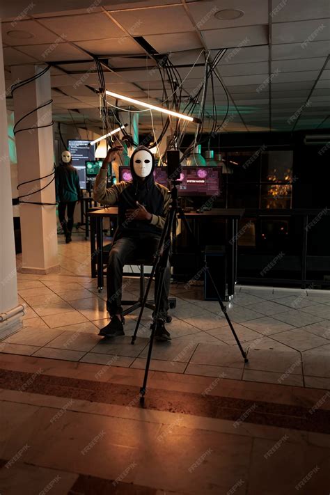 Premium Photo Young Masked Thief Threatening On Live Broadcast Video