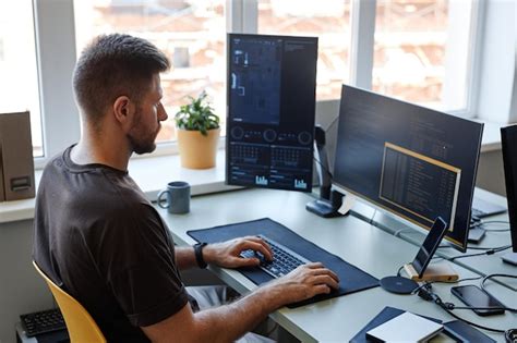 Premium Photo High Angle Portrait Of Young Software Engineer Writing