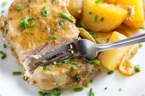 Slow Cooker Pork Chops And Potatoes • Dishing Delish