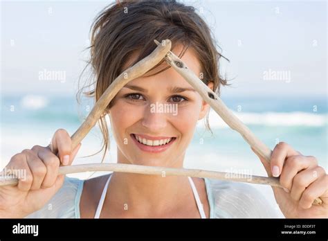 Woman Making Triangle Shape With Sticks Stock Photo Alamy