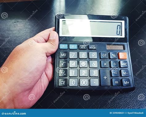 Someone Was Holding A Calculator In His Hand Stock Image Image Of
