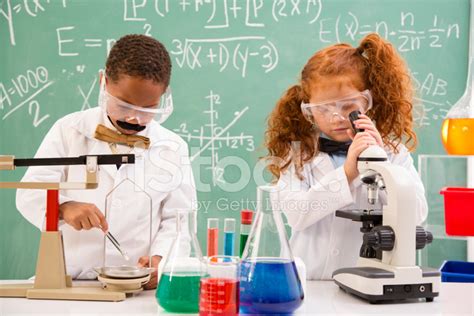 Education Young Nerd Scientists In Their Lab Doing Experiments Stock