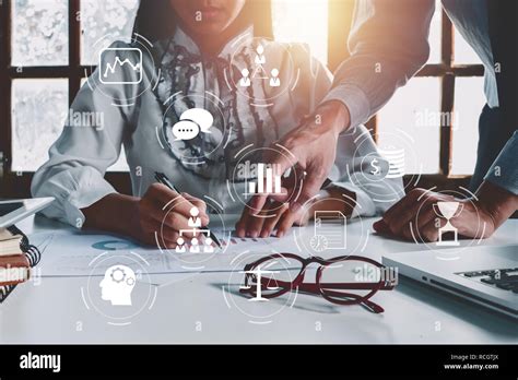 Business Team Analyzing Income Charts And Graphs With Modern Laptop