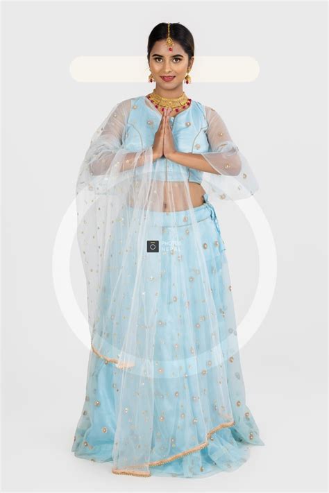 Beautiful Nepali Girl Doing Namaste In Light Blue Lehenga And Golden