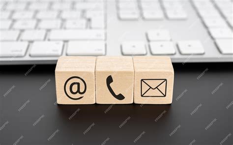 Premium Photo Contact Us Icons On Wooden Blocks And Computer Keyboard