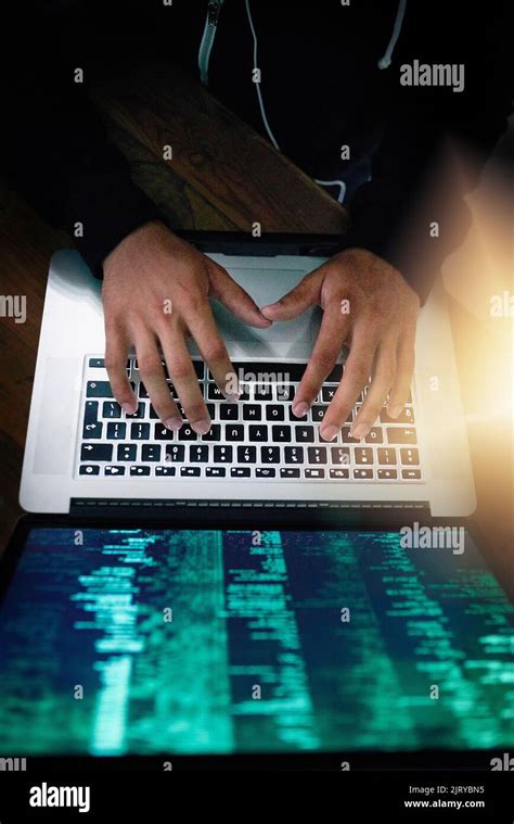 Hes The Master At Manipulating Networks High Angle Shot Of A Hacker