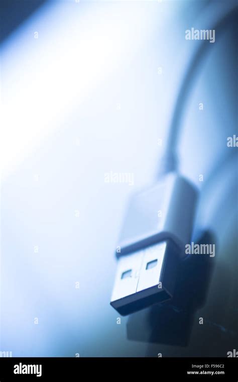 USB Cable IT PC Memory Storage Dongle Plug Socket Close Up Color Artistic Photo In Blue Tones