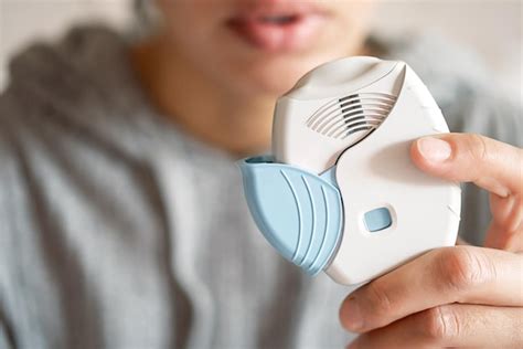 Premium Photo Woman Use Asthma Inhaler At Home Close Up