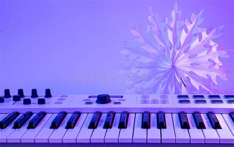 Christmas Background With Midi Keyboard And Holiday Decor With Neon