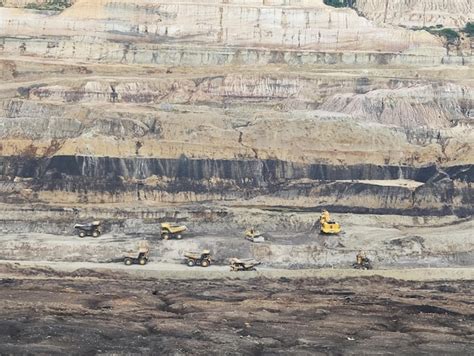 Premium Photo Work Of Trucks And The Excavator In An Open Pit On Gold Mining
