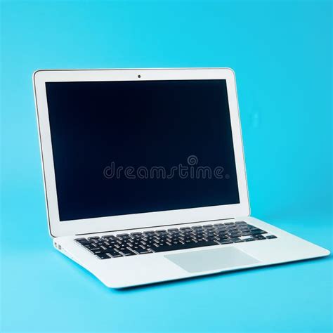 Sleek Silver Laptop With Black Screen On Turquoise Background