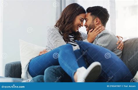 I Will Forever Keep Her Safe An Affectionate Young Couple Cuddling