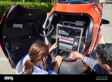 Twizzy Electric Vehicle Researchers Work In Two Electric Cars The
