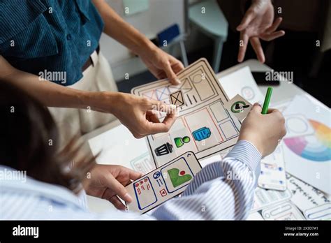 Ux Developer And Ui Designer Team Brainstorm Together About Designing Application Interface