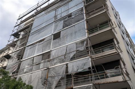 Scaffolding Being Used To Repair Broken Window On High Rise Building Stock Illustration