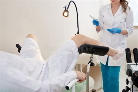 Gynecologist Using Vaginal Swab For Std Testing Young Patient Stock