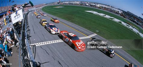 Dale Earnhardt Sr And Dale Earnhardt Jr In Action Taking The Green