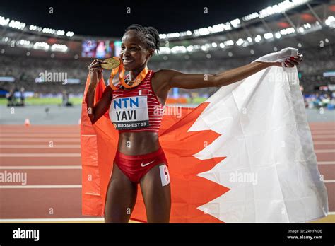 Winfred Mutile Yavi Celebrating Her Victory With Her Countrys Flag In The 3000m Steeplechase At