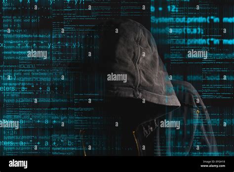 Faceless Hooded Anonymous Computer Hacker With Programming Code From