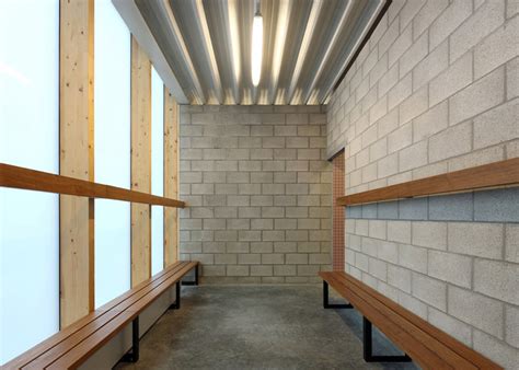 School Gymnasium By Ura Nestles Into The Landscape At A Belgian School