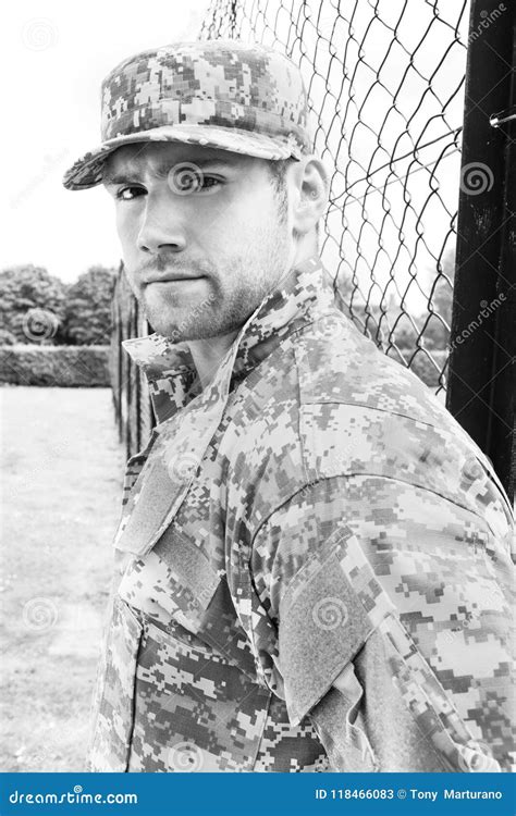 Marine Soldier In His Army Fatigues Stands To Attention At Military
