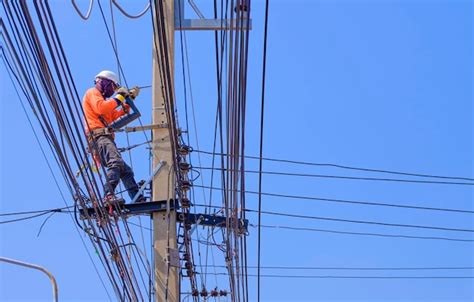 Premium Photo Electrician Is Working To Install Electrical System On