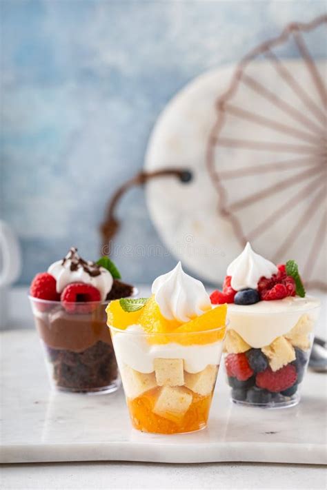 Variety Of Small Desserts In Cups Chocolate Berry And Orange Stock