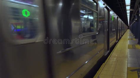 Shiny Clean Reflective Sheet Metal Surface Of An MTA New York Subway Train Departs The Th
