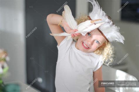 Girl Wearing Feather Headdress — Looking At Camera Person Stock