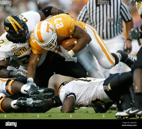 Tennessee Tailback Arian Foster 27 Dives Forward For Yardage As Hes
