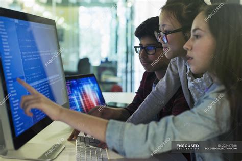 Students Programming At Computer In Computer Lab Classroom — Multi