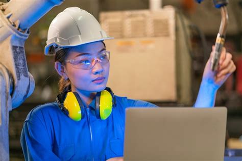 Premium Photo Female Engineer Programming Robotic Arm Machine For