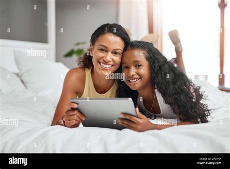 Were Always Entertained By The Internet A Mom And Daughter Lying On