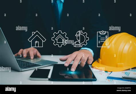 Architect Or Engineer Using Tablet To Work On Table Cost Calculation