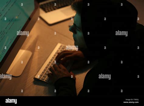 Hacker With Computer And Laptop Stock Photo Alamy