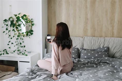 Pretty Young Woman Sitting In Bed And Makes Selfie Stock Image Image