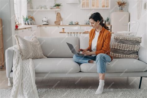premium photo relaxed european woman working with computer at home